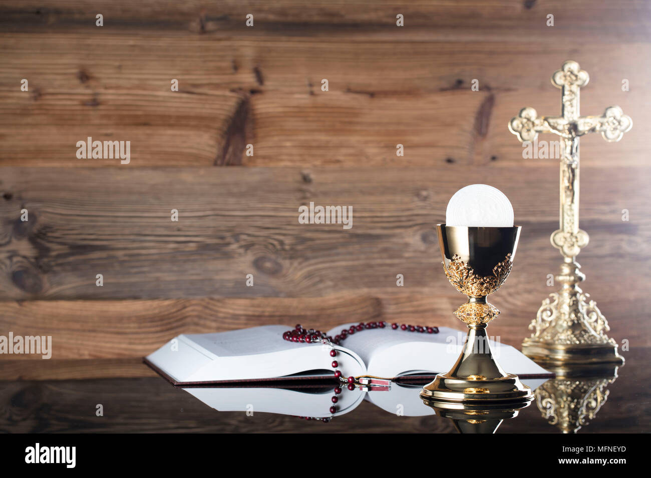 First holy communion theme. The Cross, Holy Bible, rosary and golden ...