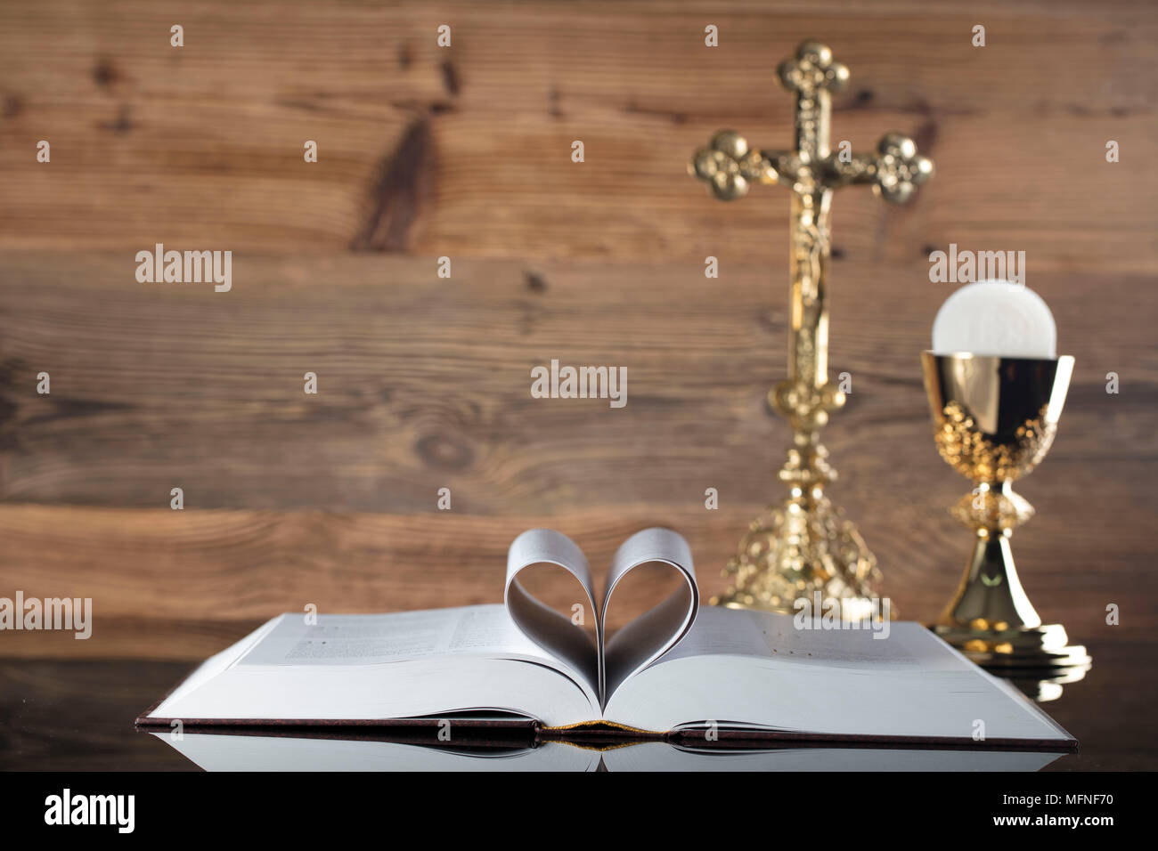 First holy communion theme. The Cross, Holy Bible, rosary and golden ...