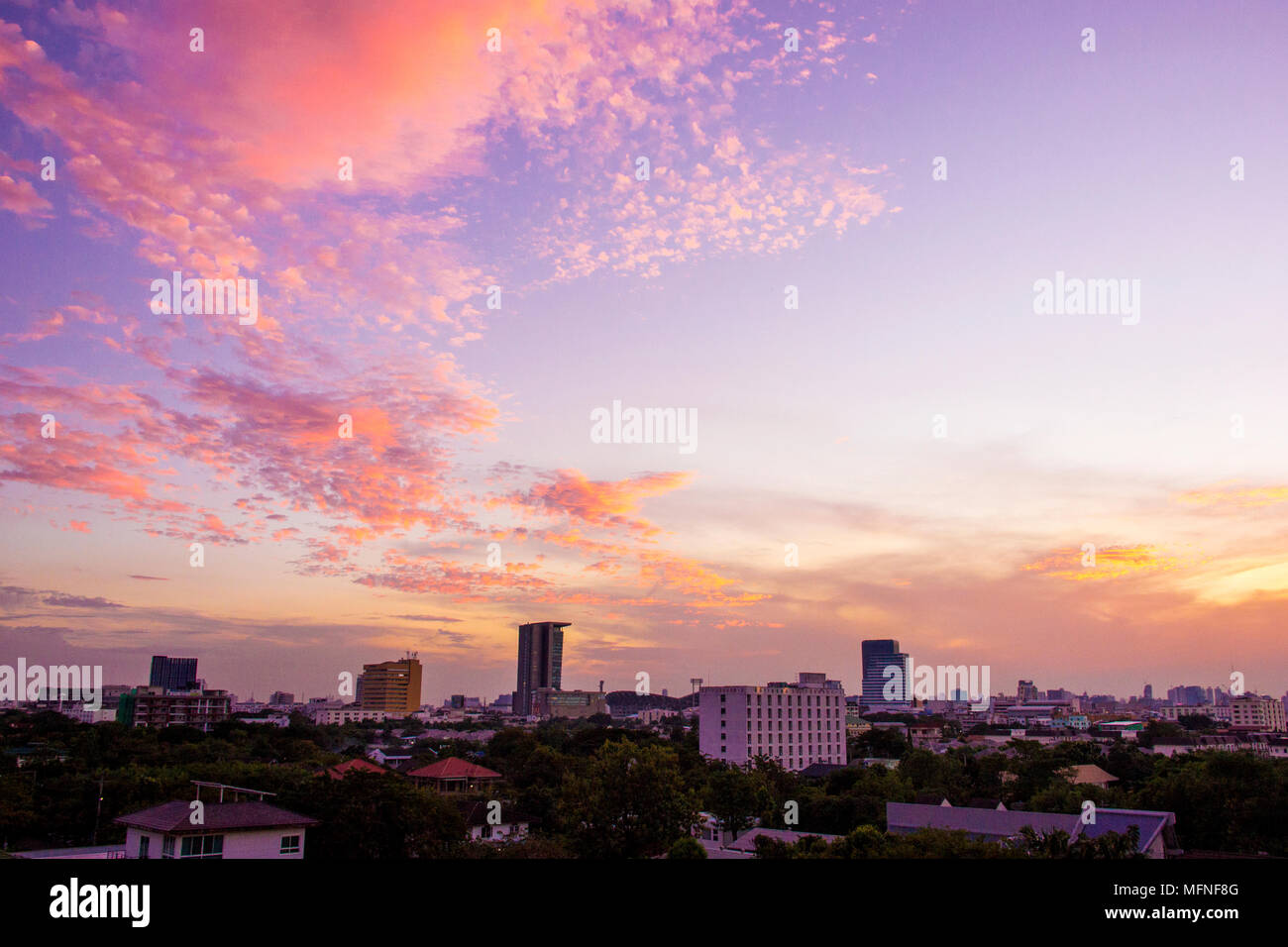 Dusk cloud sky over urban city, background image Stock Photo - Alamy