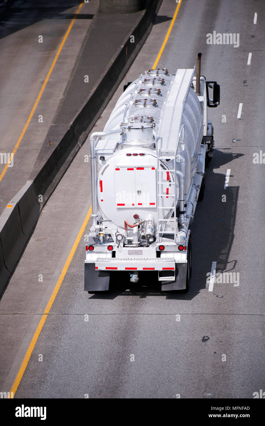 Big rig day cab semi truck transports in special designed tank semi ...