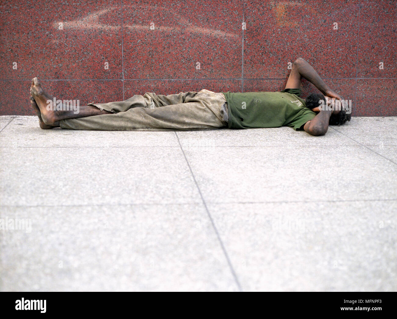 Mid adult man sleeping on the floor Ref: CRB422 10029 061 Compulsory ...