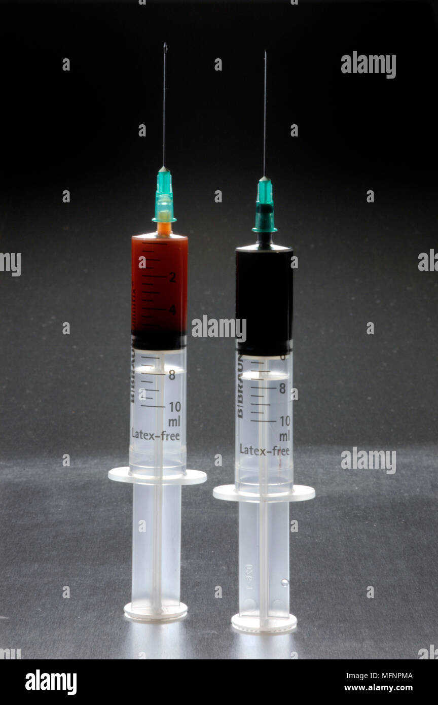 Two medical syringes needles hi-res stock photography and images - Alamy