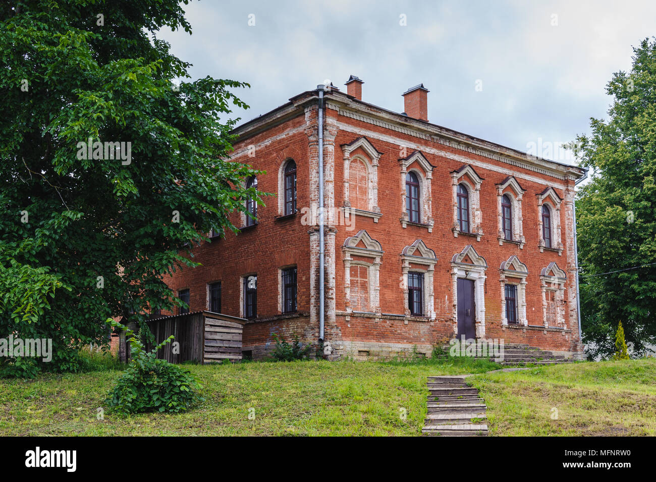 Red bricks Russian building on the green grass Stock Photo - Alamy