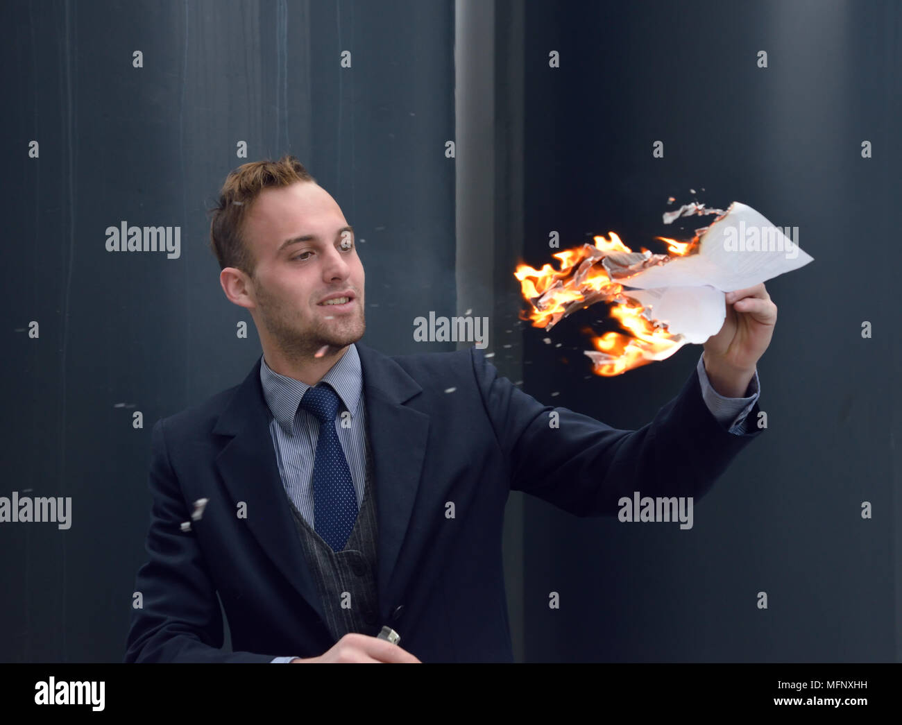 businessman burns paper contract Stock Photo - Alamy