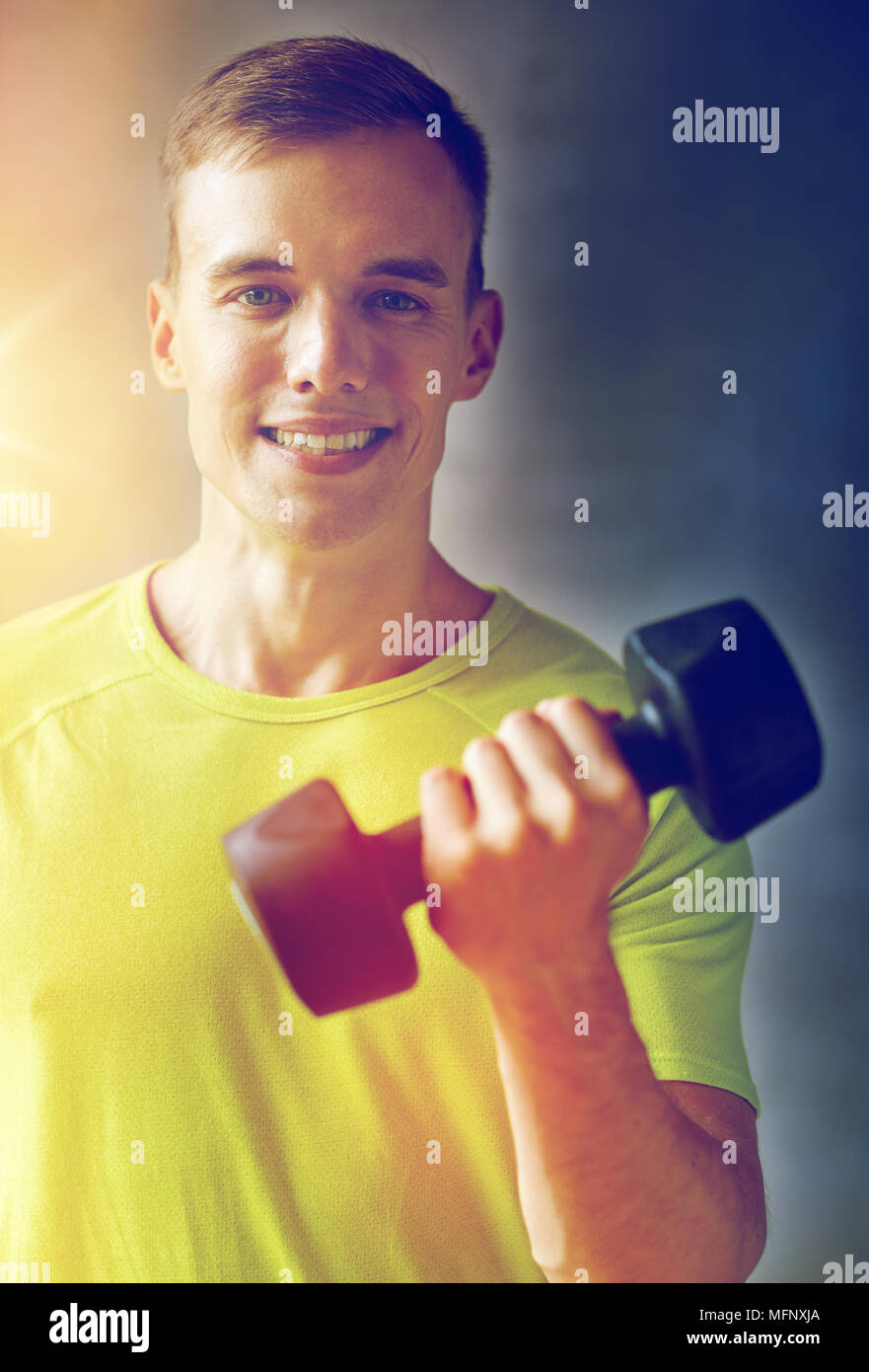 Handsome fitness man holding dumbbell hi-res stock photography and ...