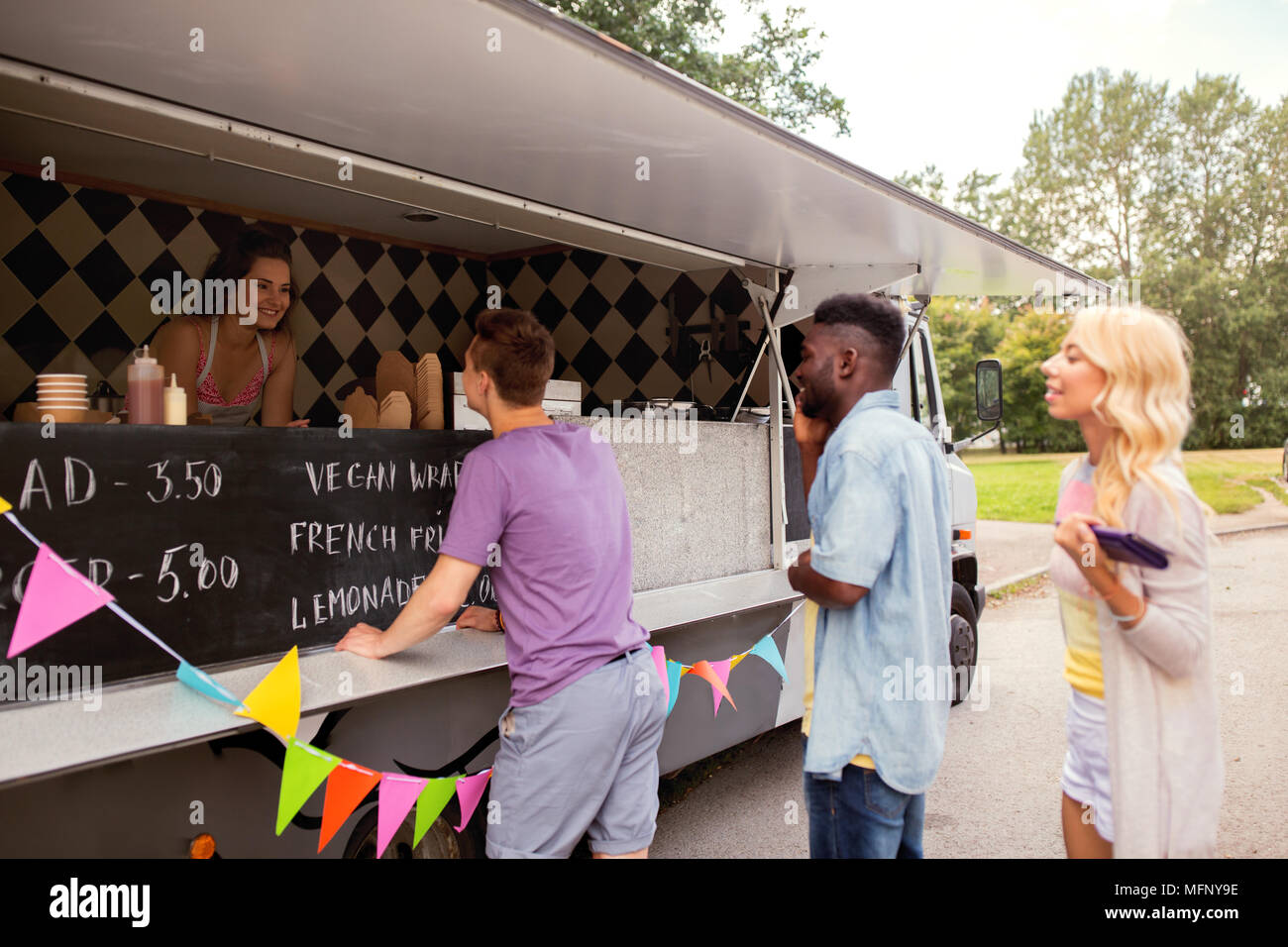 happy customers queue at food truck Stock Photo - Alamy