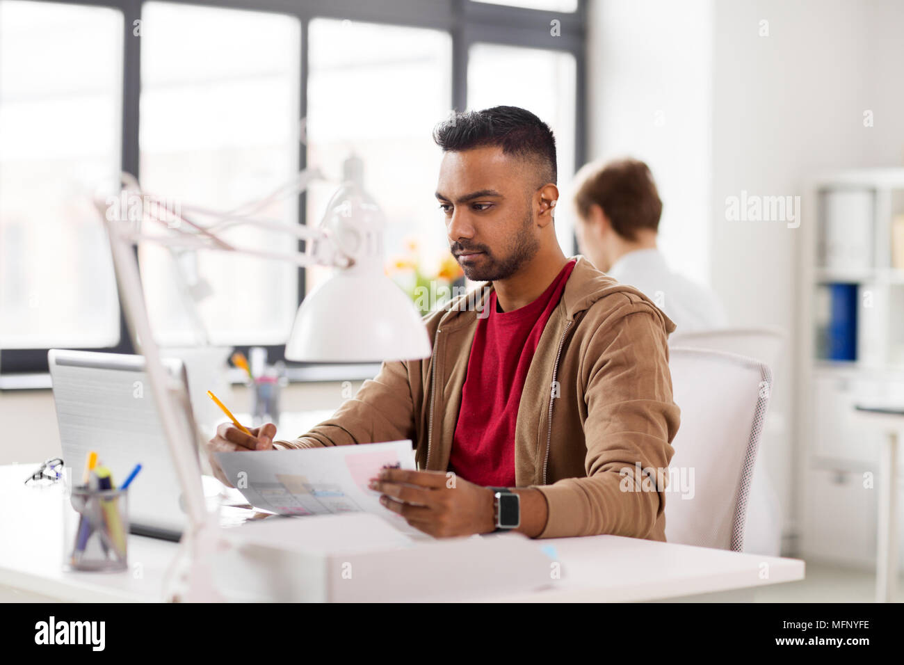 indian man with laptop computer at office Stock Photo - Alamy
