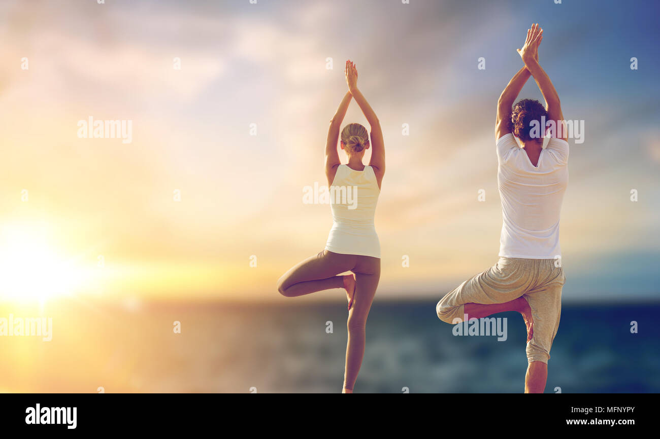 Young man yoga tree pose hi-res stock photography and images - Alamy