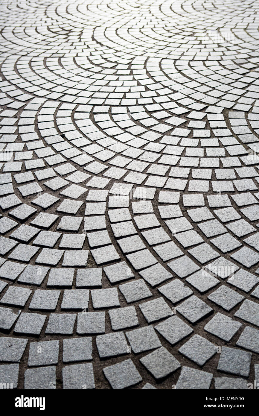 Abstract pattern creted by small concrete tiles on the floor of a ...