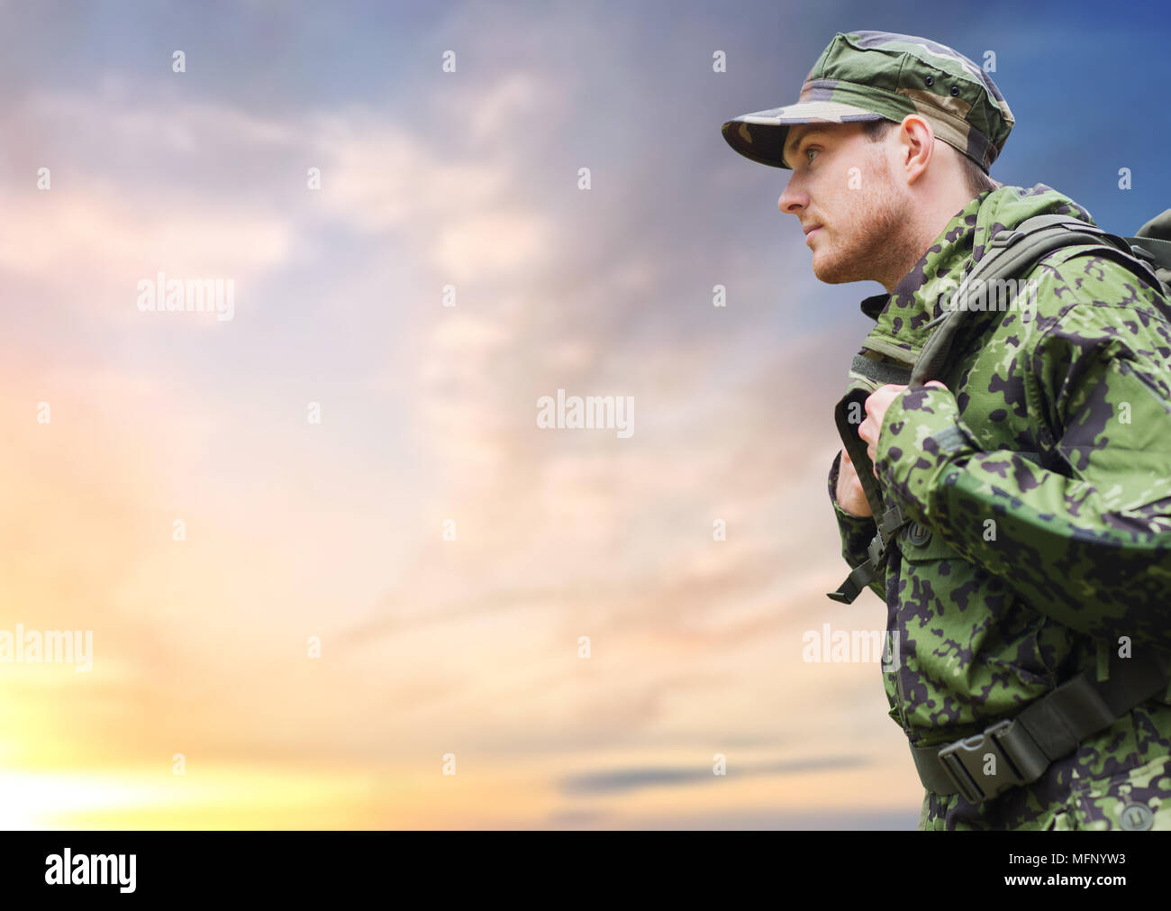 soldier in military uniform with backpack hiking Stock Photo - Alamy