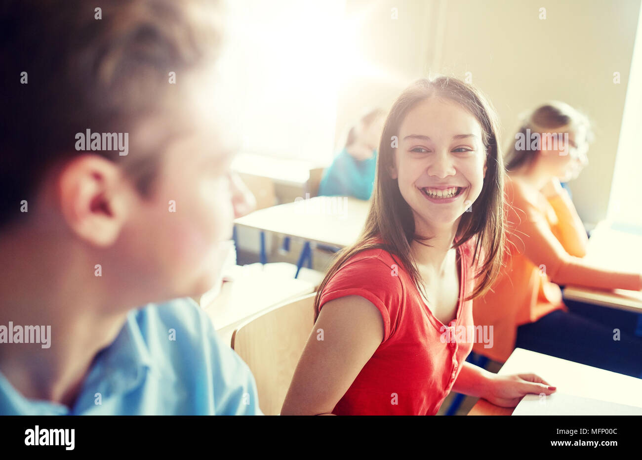 group of happy students talking at school break Stock Photo - Alamy