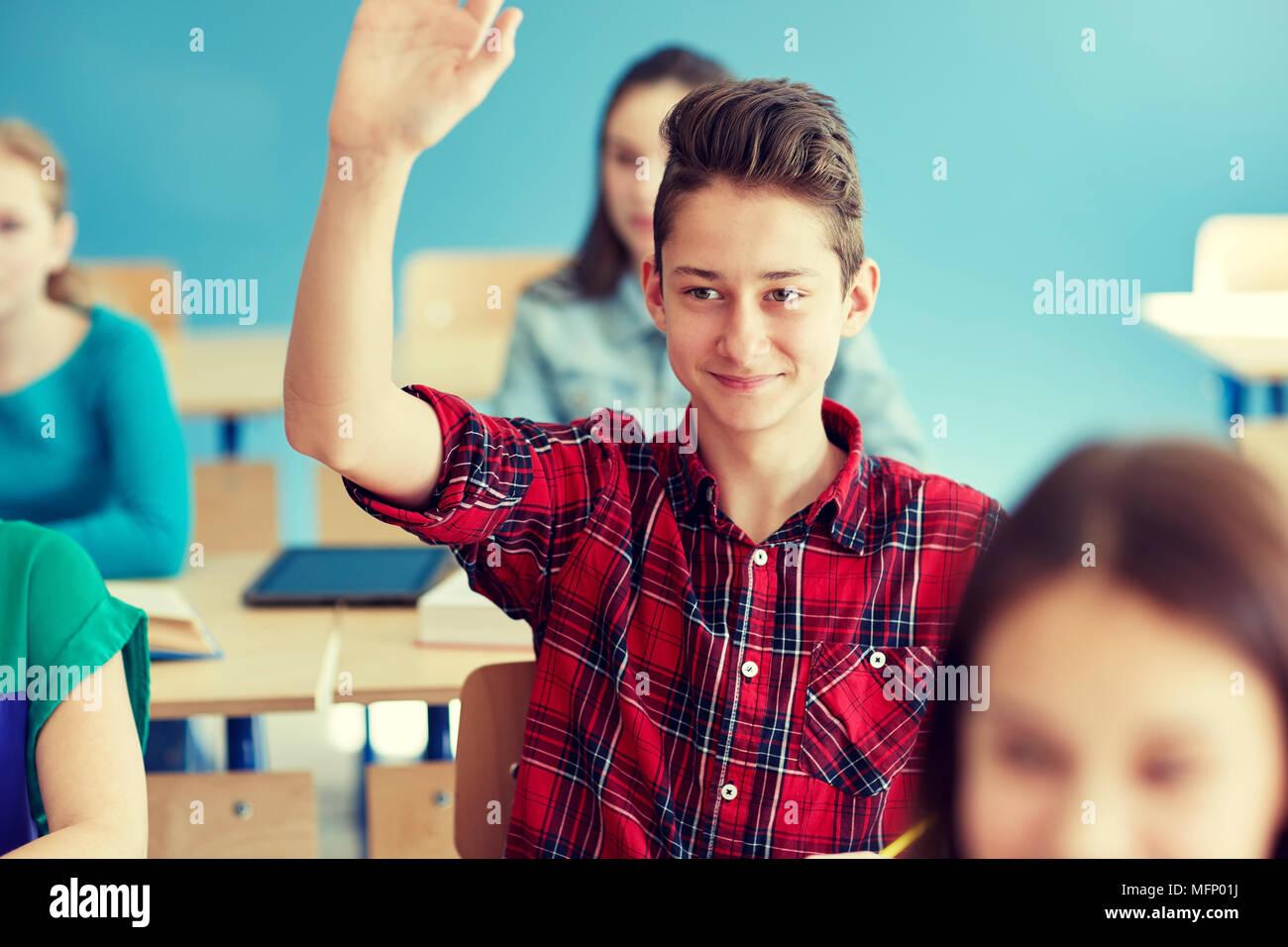 Child raising hand classroom hi-res stock photography and images - Alamy