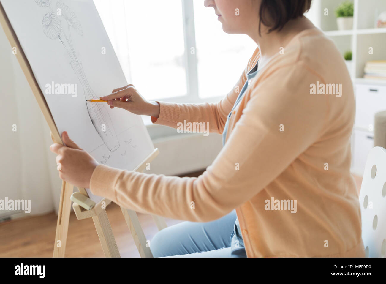 artist with pencil drawing picture at art studio Stock Photo - Alamy