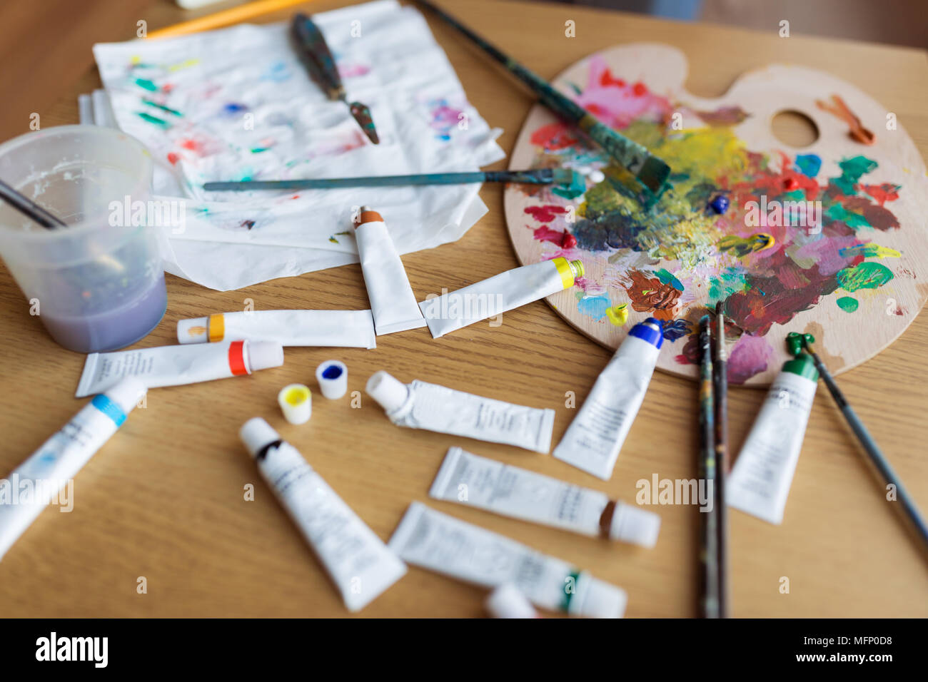 palette, brushes and paint tubes on table Stock Photo - Alamy
