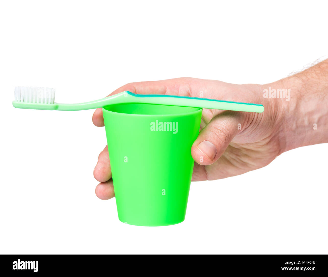Hand with toothbrush on white Stock Photo - Alamy