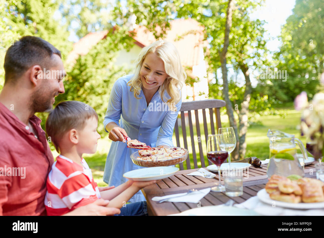 Generation family eating outdoors table hi-res stock photography and ...