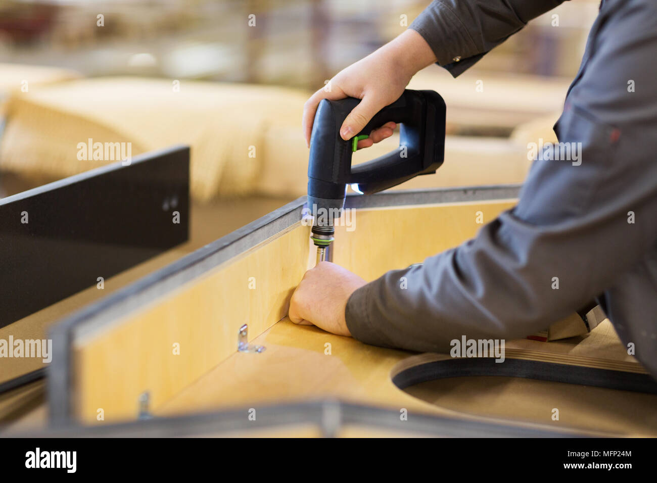 Process furniture production young man hi-res stock photography and ...