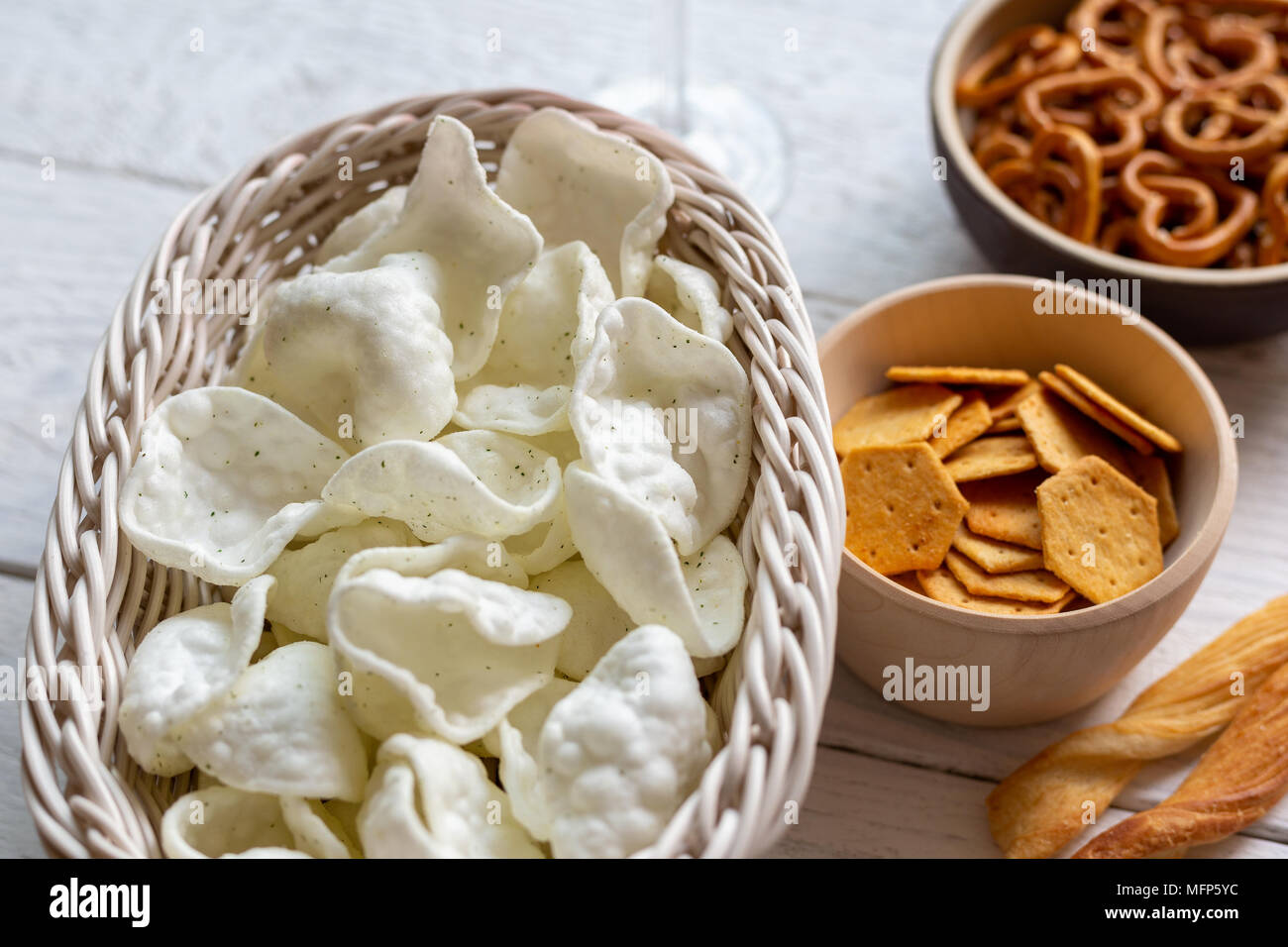 Selection of savoury party snacks on rustic white wood background from ...