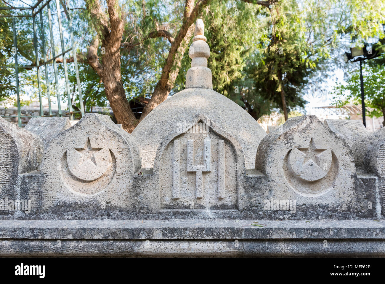Turk word is engraved with old Turkish alphabet on wall with two ...