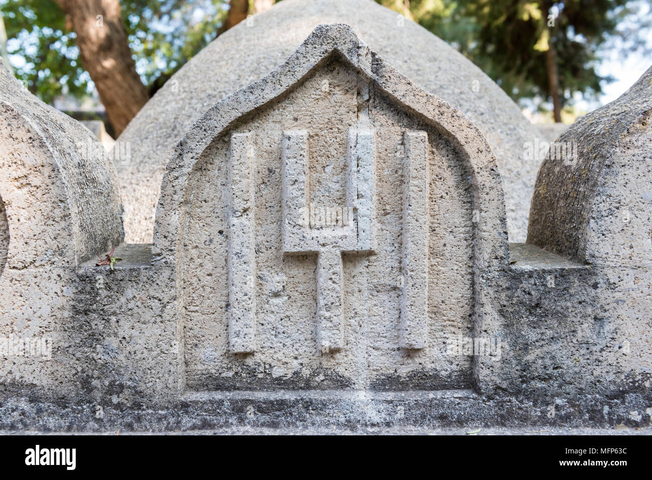 Turk word is engraved with old Turkish alphabet on wall in bodrum ...