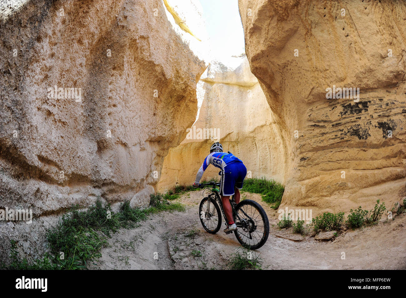 A man rides a mountain bike in Cappadocia, central Turkey Stock Photo ...
