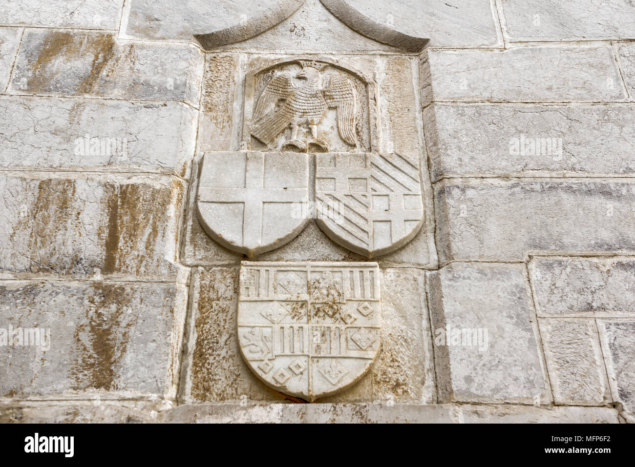 Cross and other signs carved into the wall of ancient Roman marble ...