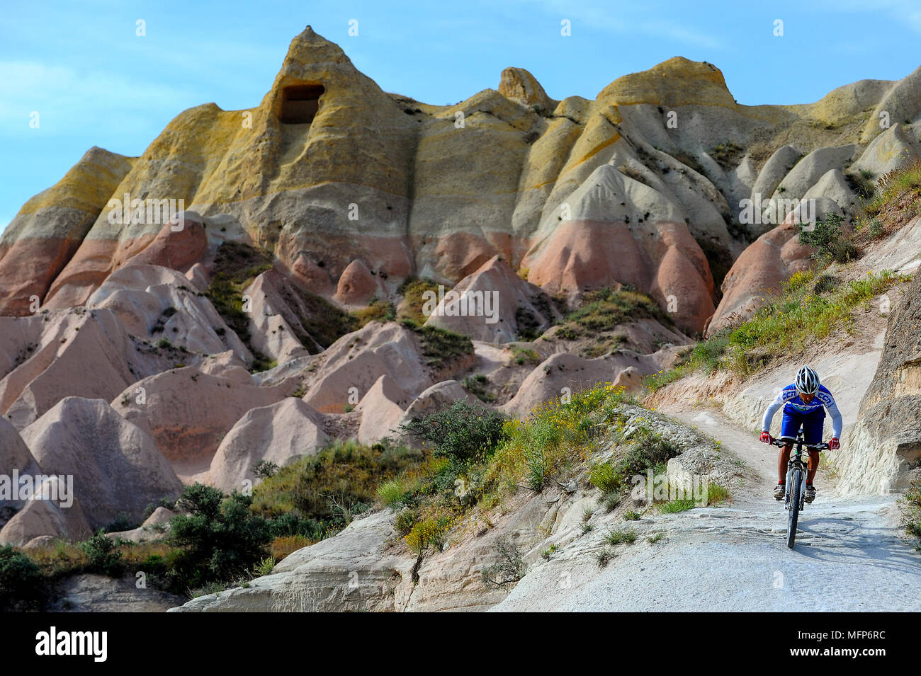 A man rides a mountain bike in Cappadocia, central Turkey Stock Photo ...