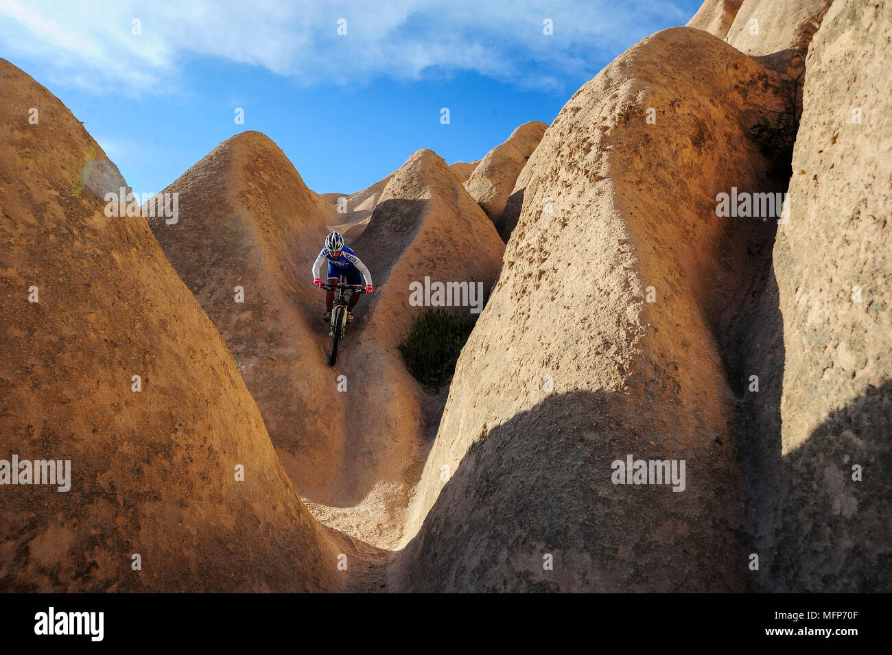 A man rides a mountain bike in Cappadocia, central Turkey Stock Photo ...
