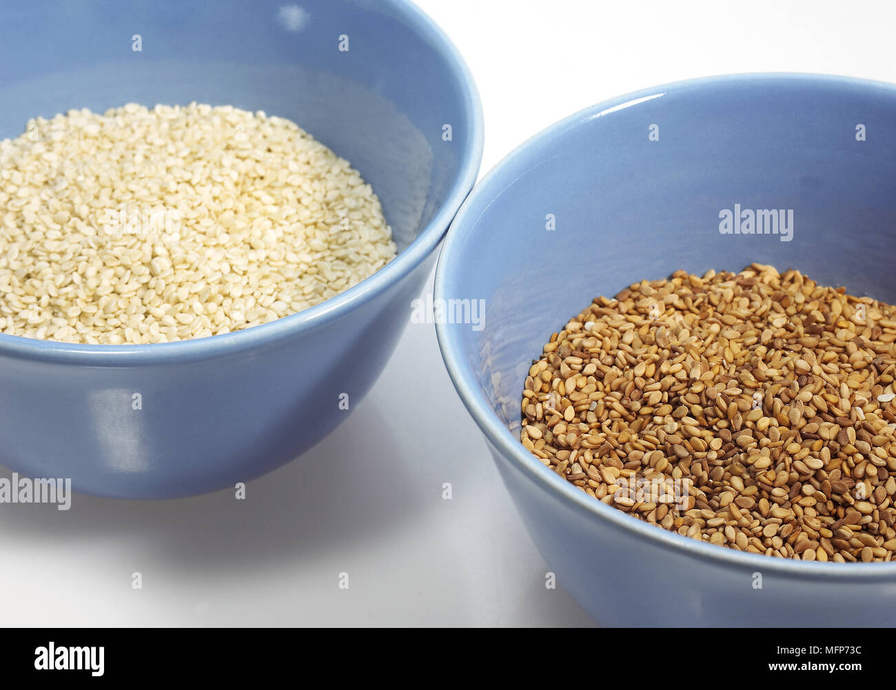 Natural Sesame and Gold Coloured Sesam, sesamum indicum, Seeds against ...