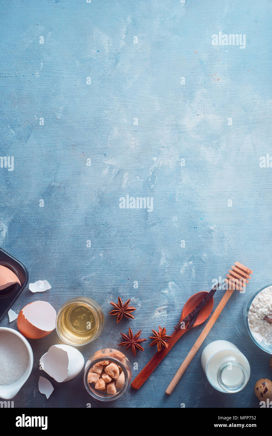 Baking tools and ingredients on a textured concrete background. Cooking ...