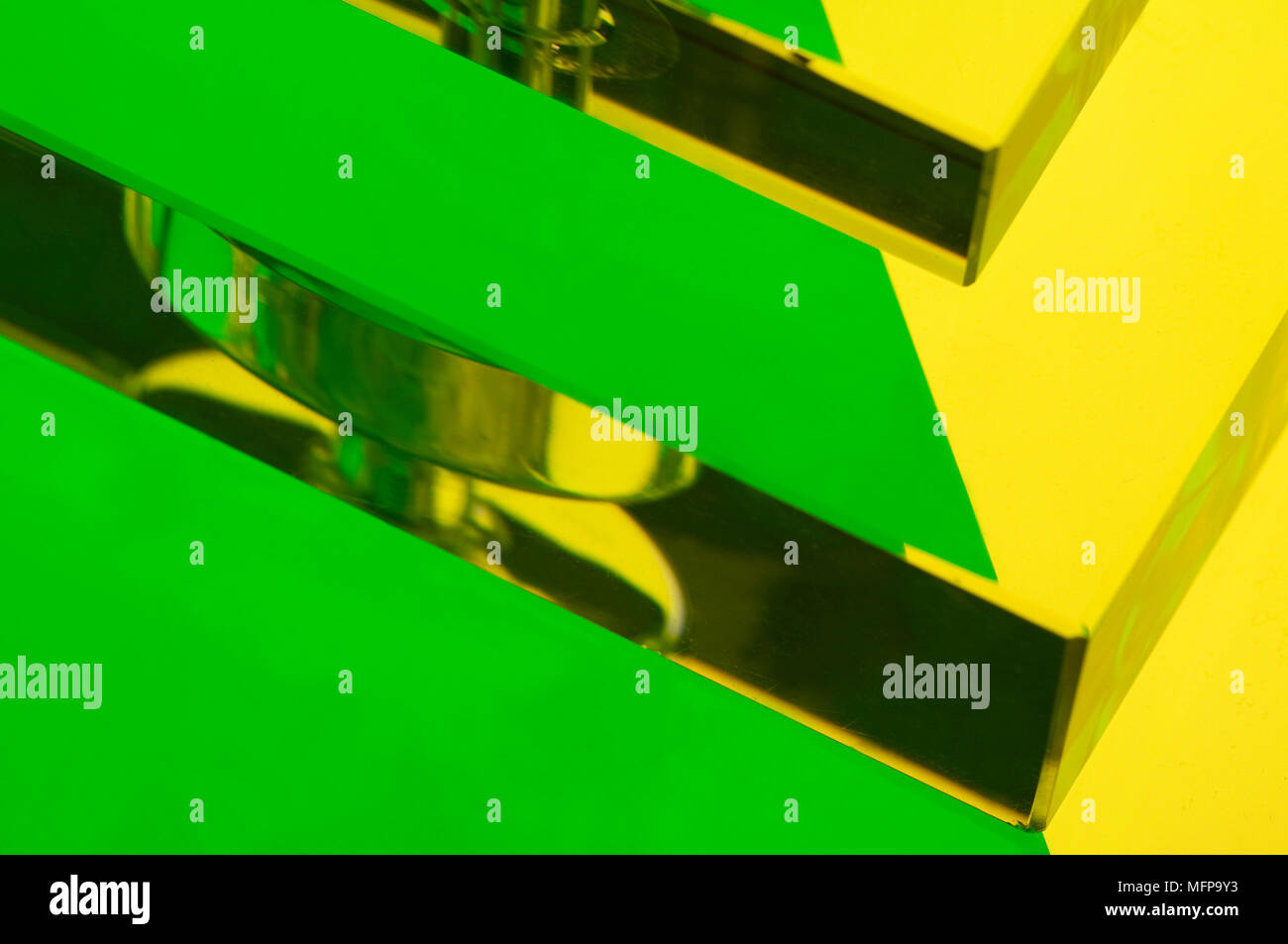 Close-up of wedge-shaped angular glass showing reflected shapes ...