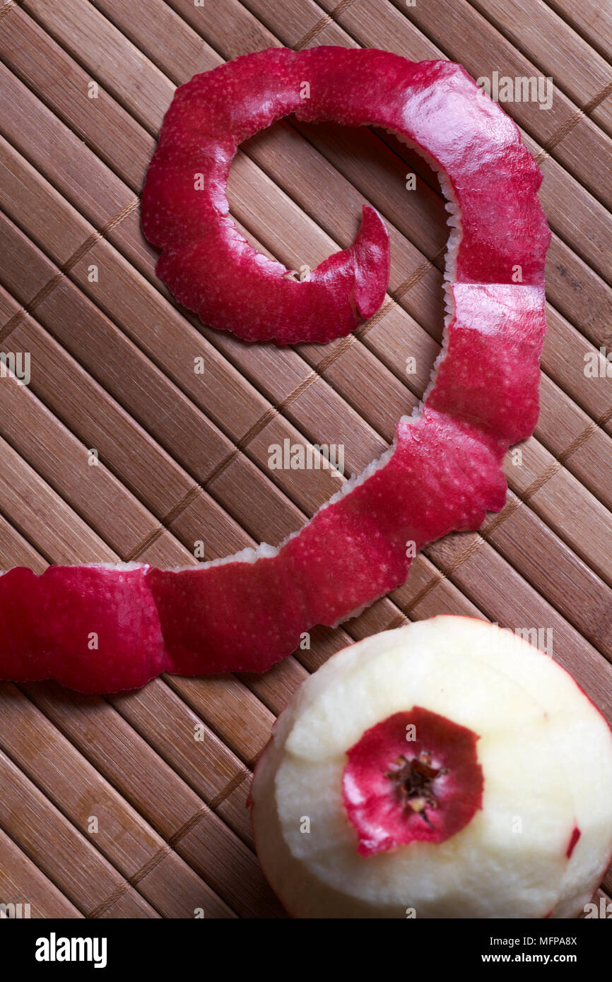 Number 9 shiny red apple skin with peeled apple Stock Photo - Alamy