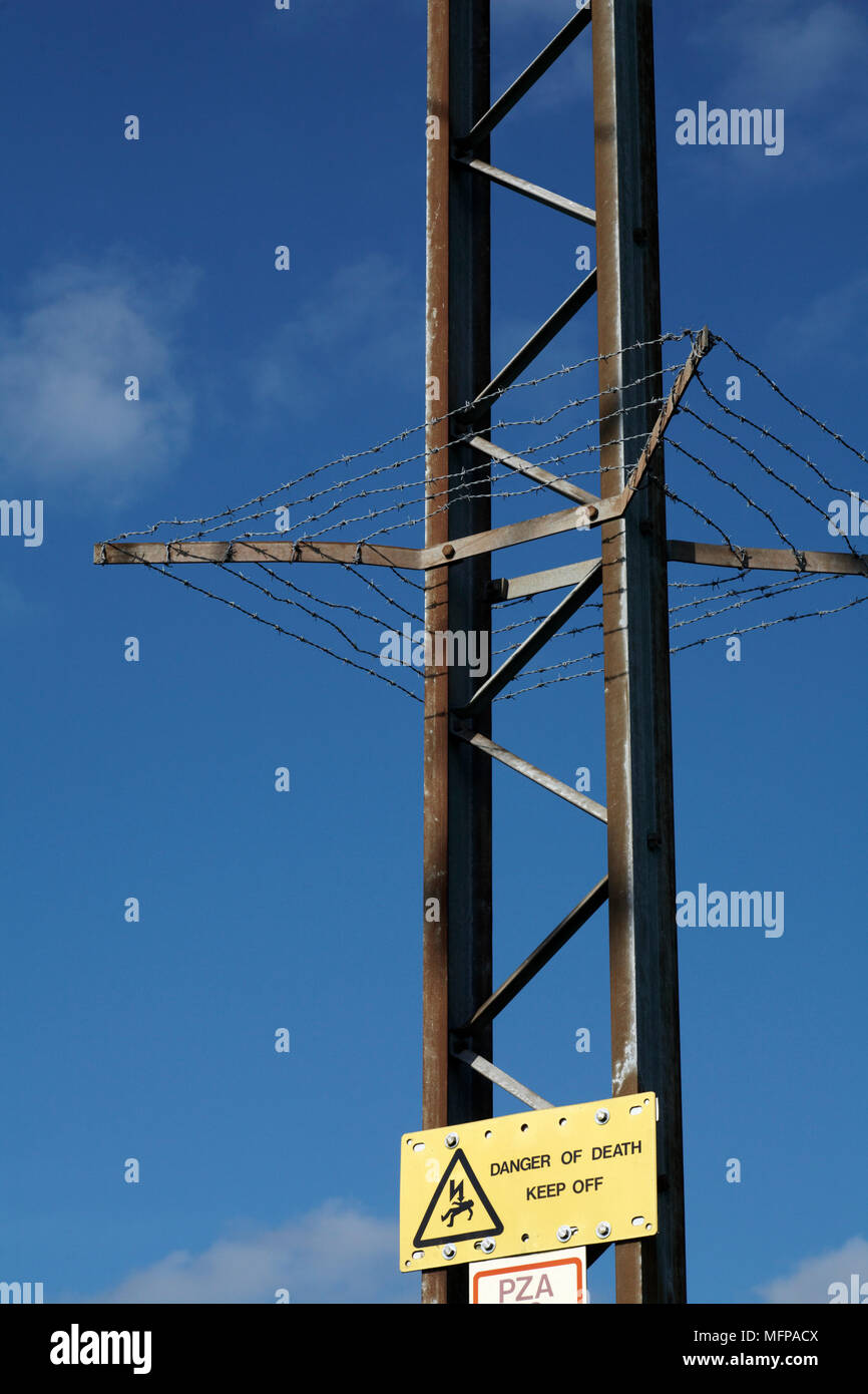 Warning sign on electricity pylon hi-res stock photography and images ...