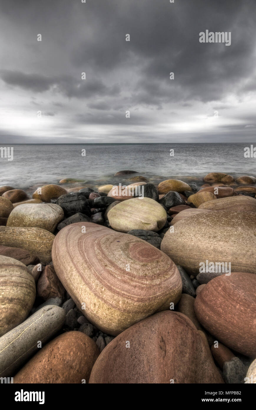 Beach with colourful rocks and dramatic sky at Rackwick, Hoy, Orkney ...