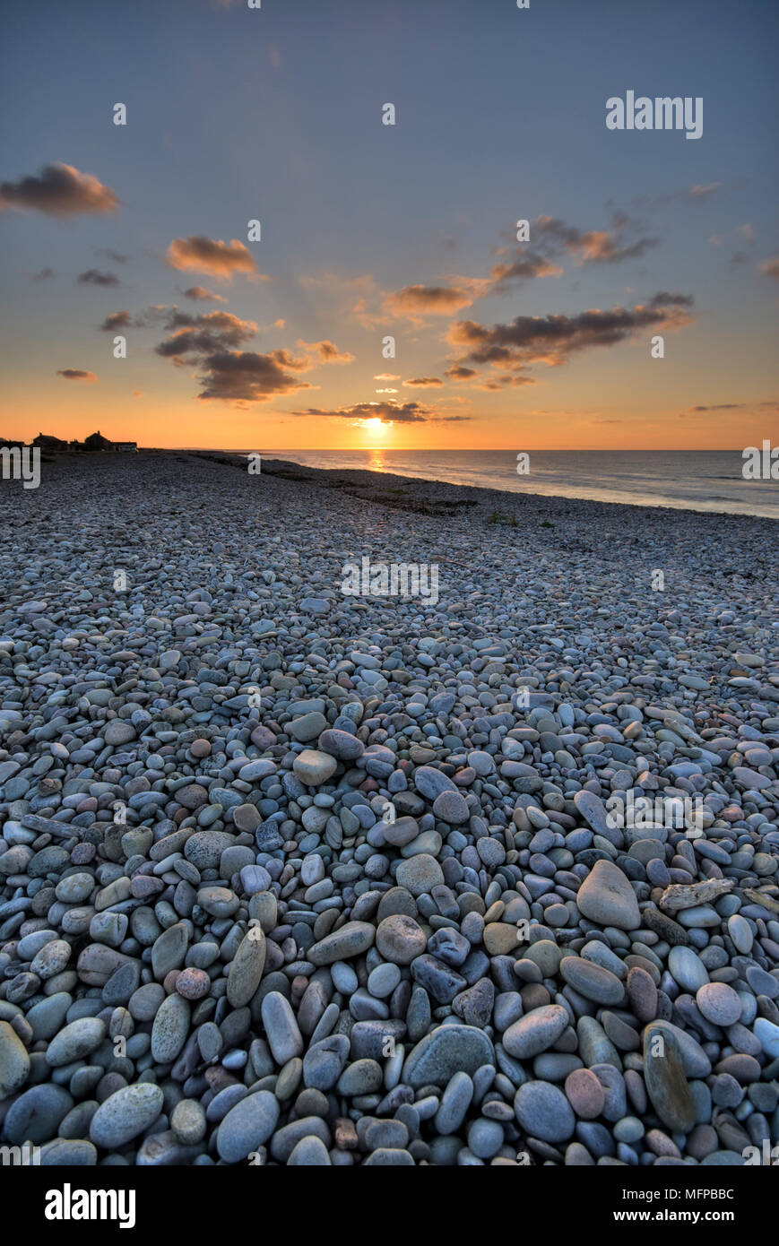 Sunset with pebble beach at Moray Firth, Aberdeenshire, Scotland Stock ...