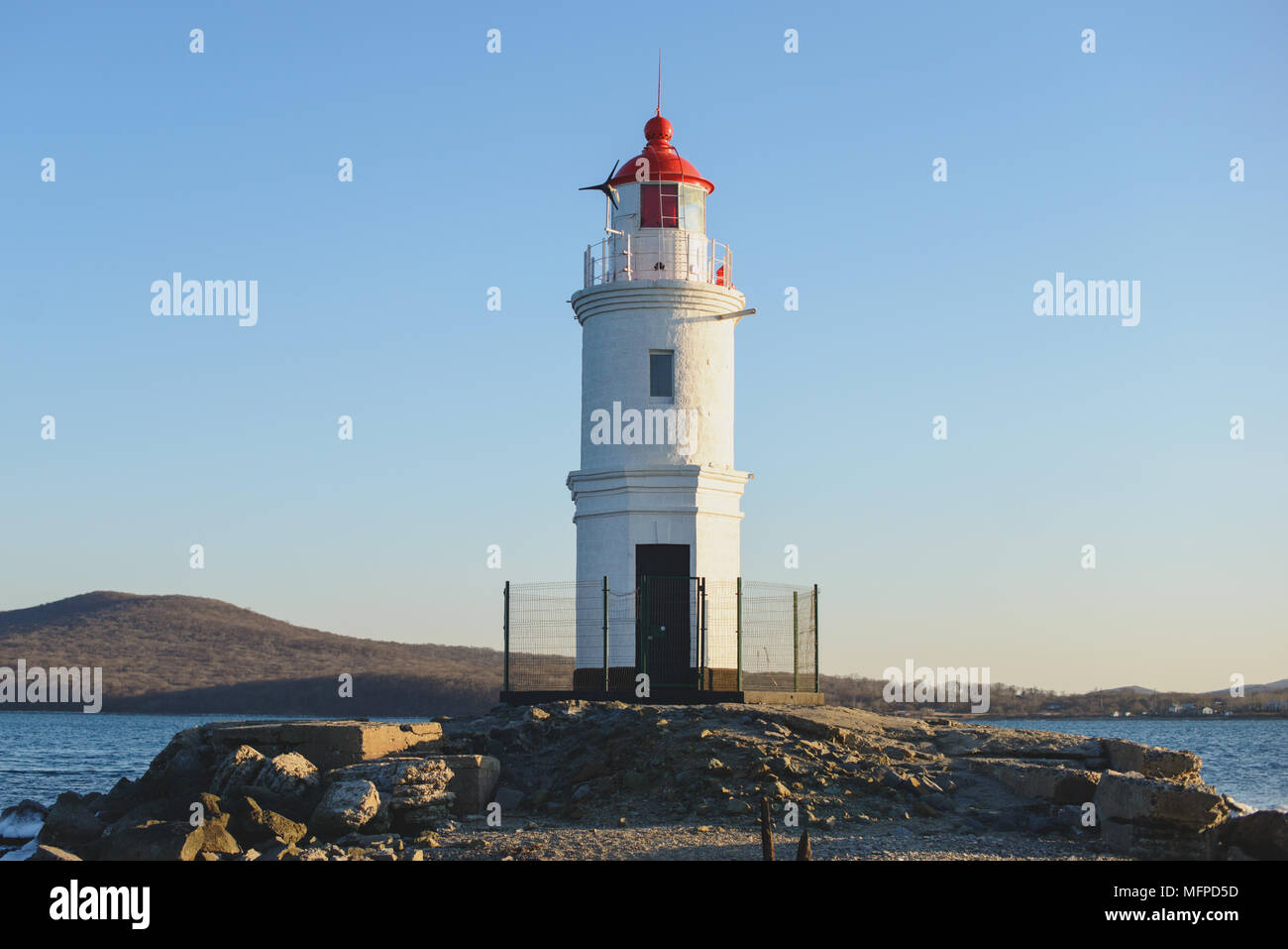 Lighthouse on the seacoast at sunset light. Nature background. Free ...