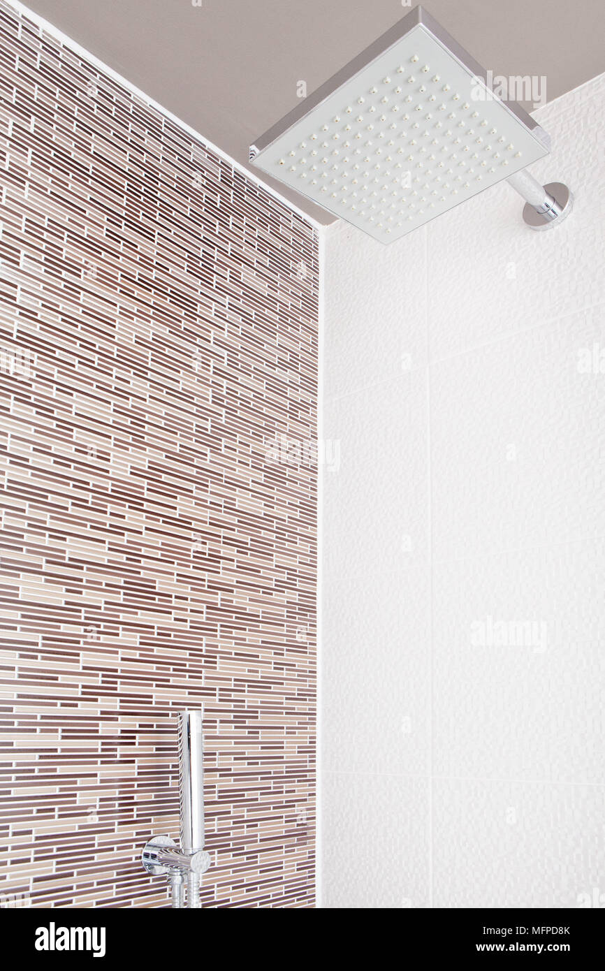 Corner of tiled shower with square showerhead Stock Photo - Alamy