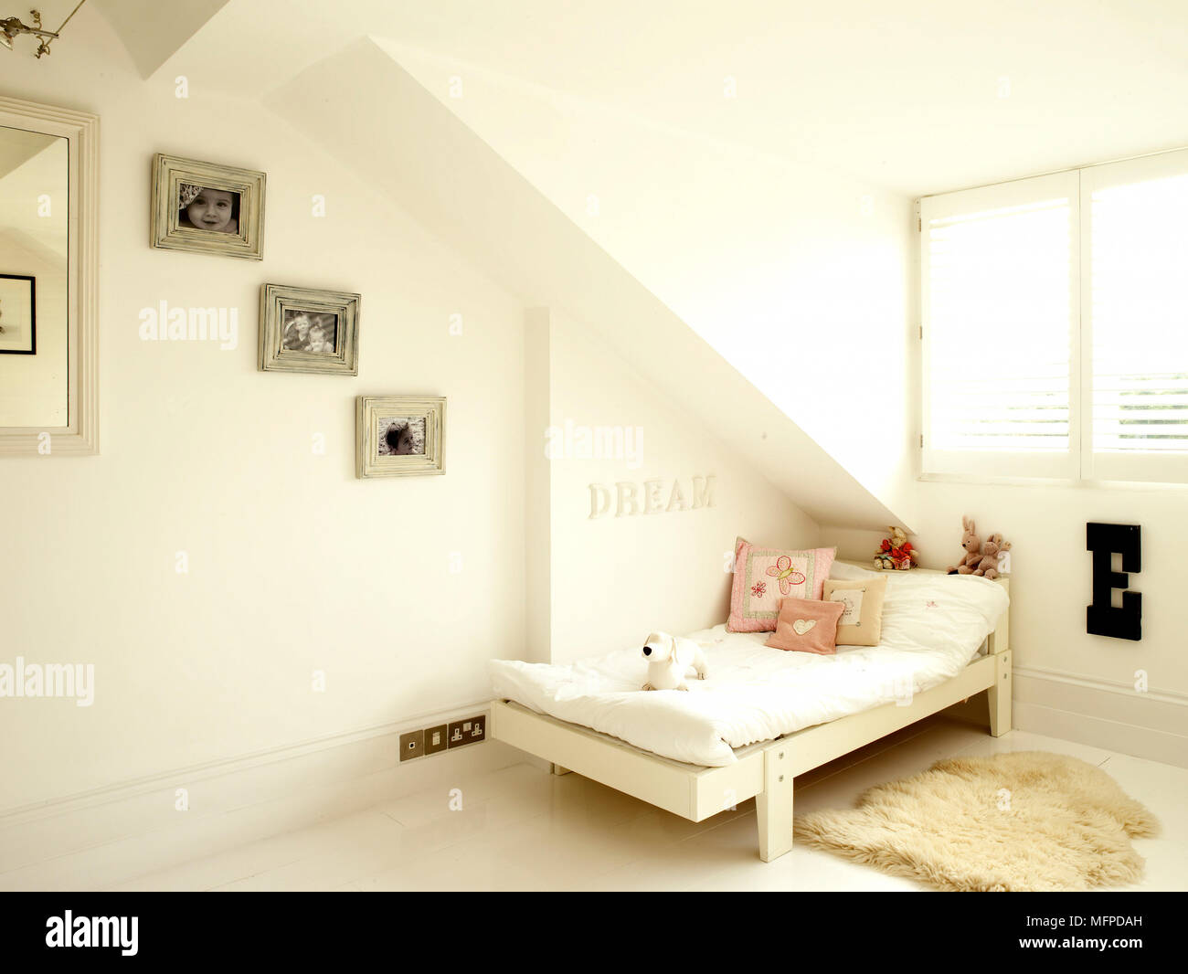 ChildÕs bed beneath window in light bedroom Stock Photo - Alamy