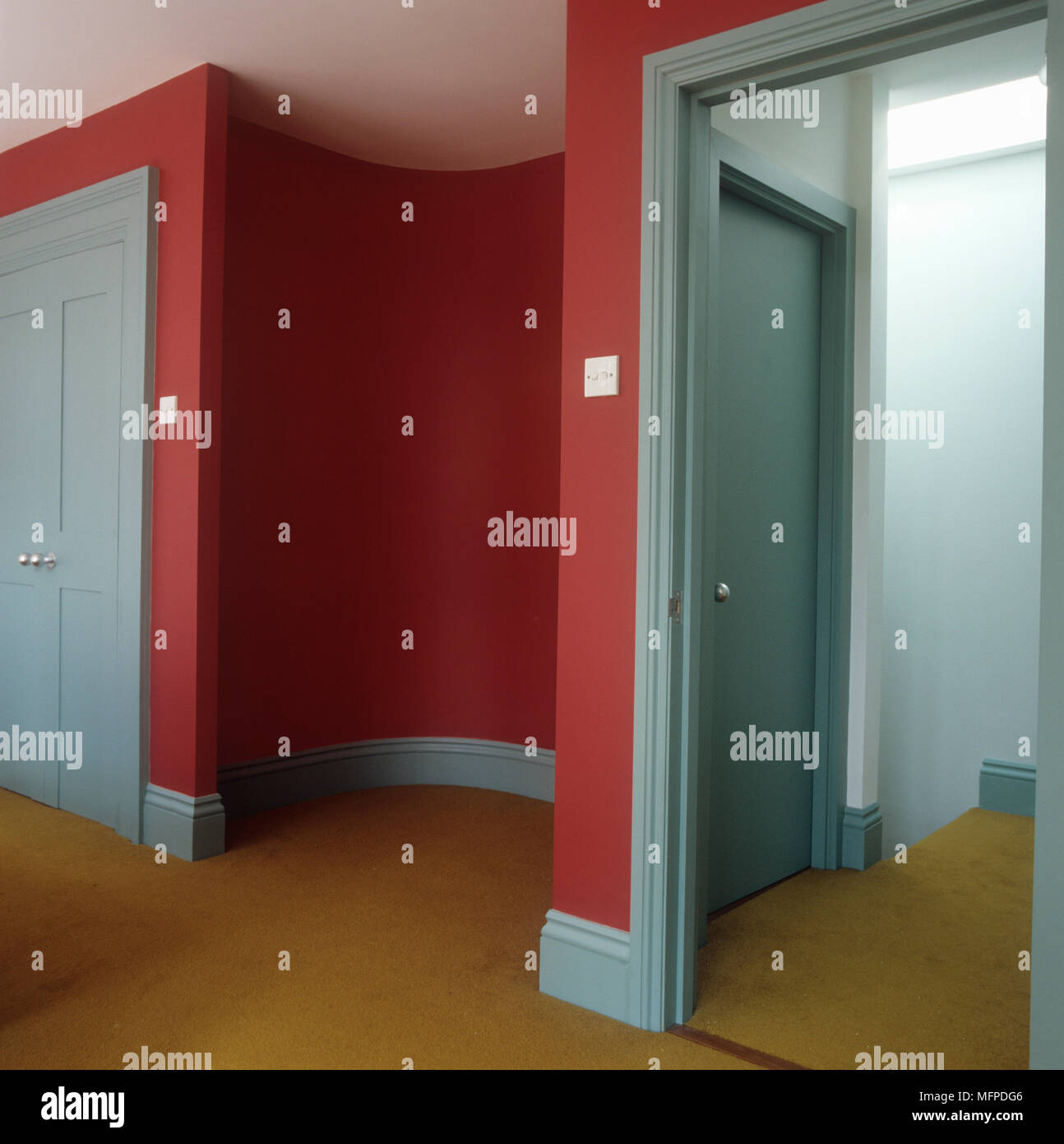 Red and green hallway with recess Stock Photo - Alamy