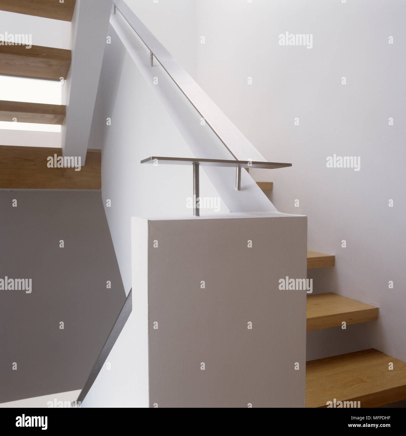 Modern wooden staircase with steel banister Stock Photo - Alamy