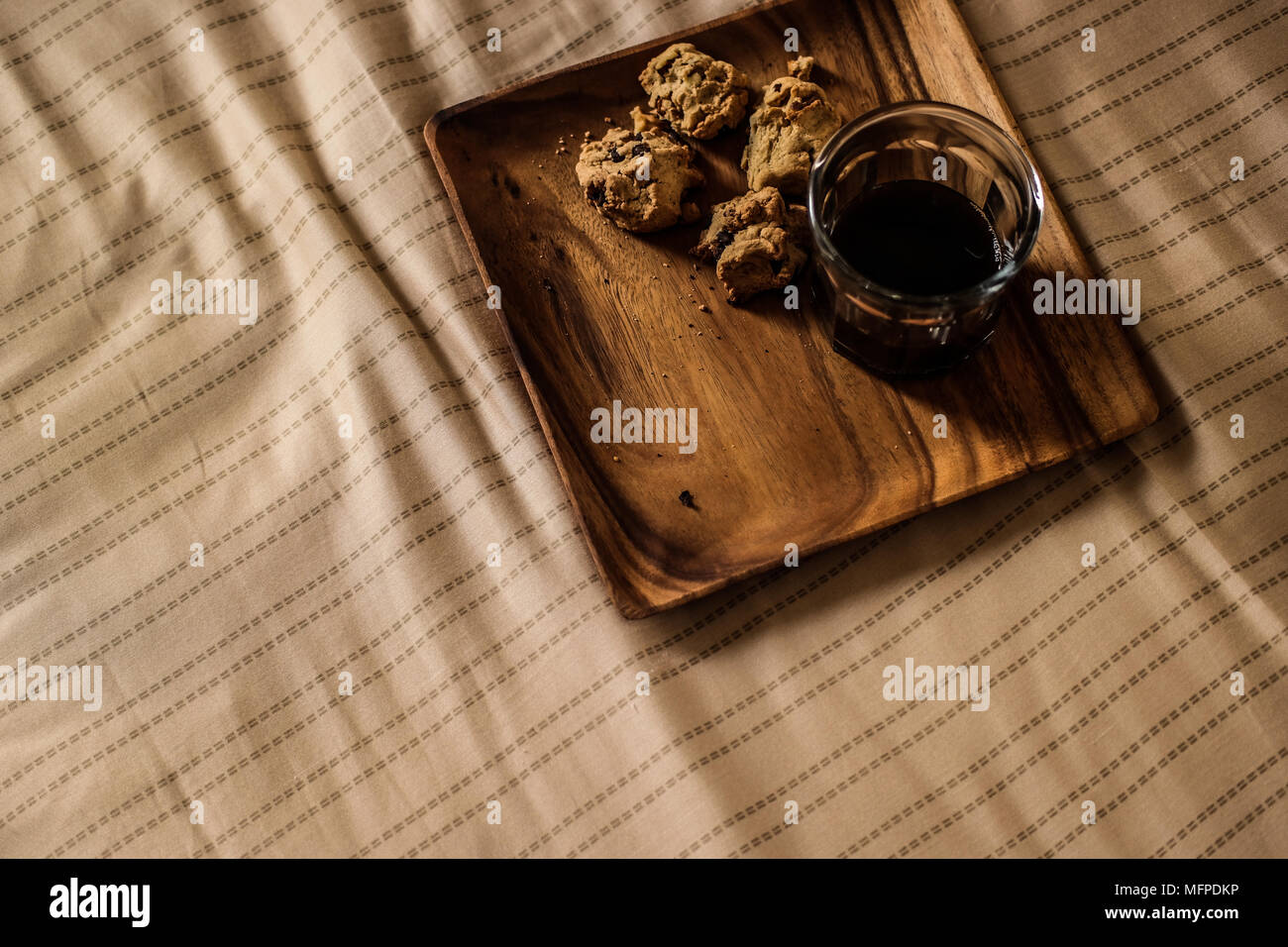 Chocolate chip cookies with coffee on the bed. (Bedroom Concept Stock ...