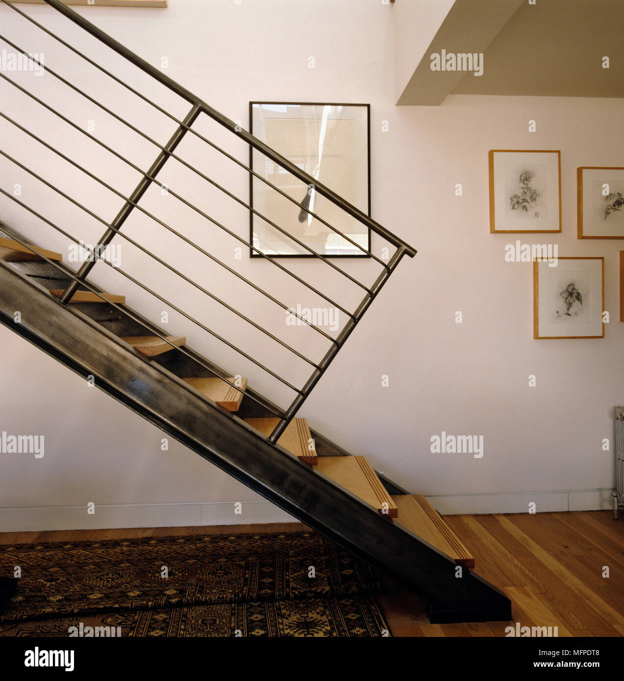 Staircase with steel banister Stock Photo - Alamy
