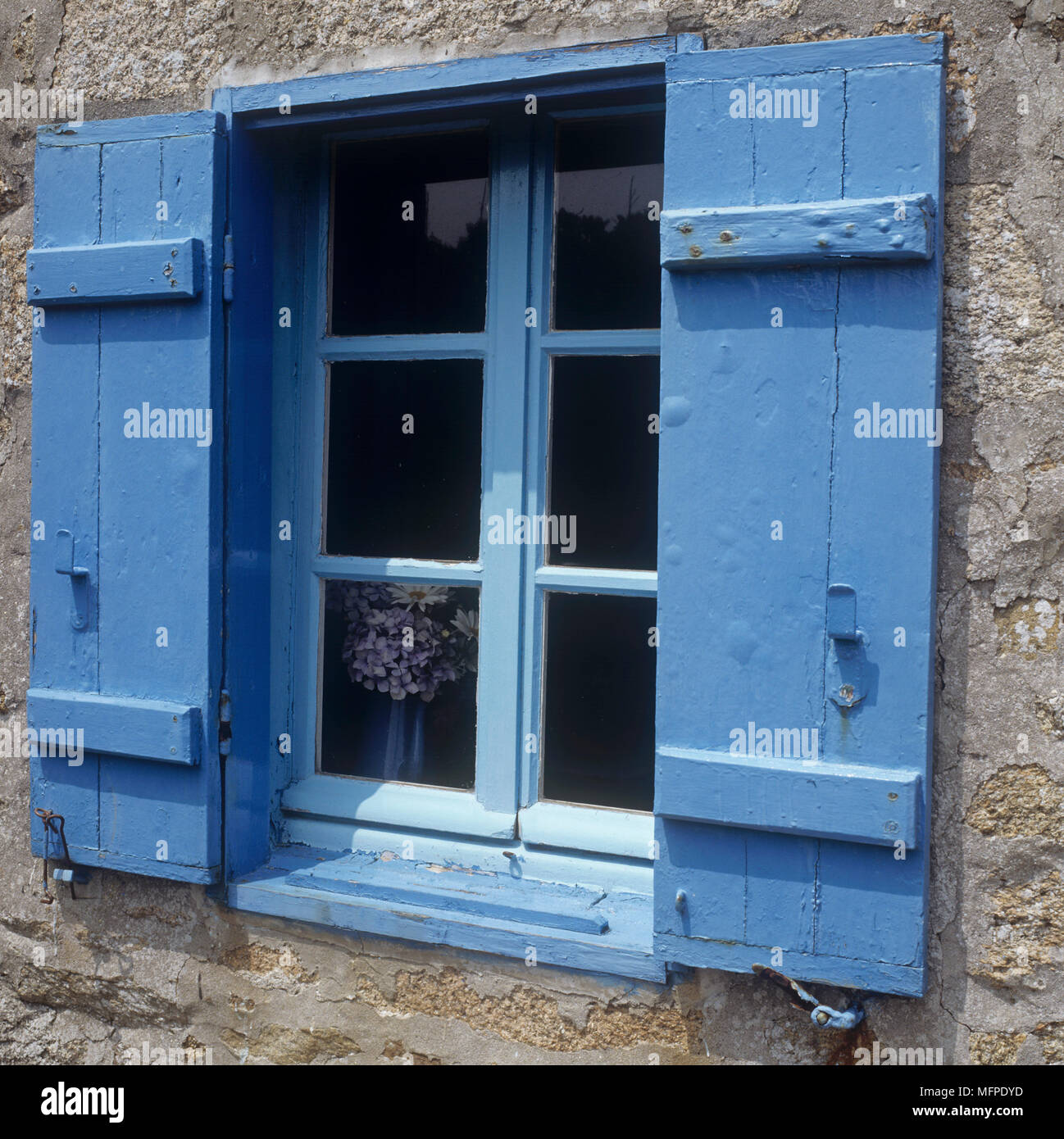 Exterior window with blue painted shutters Stock Photo - Alamy