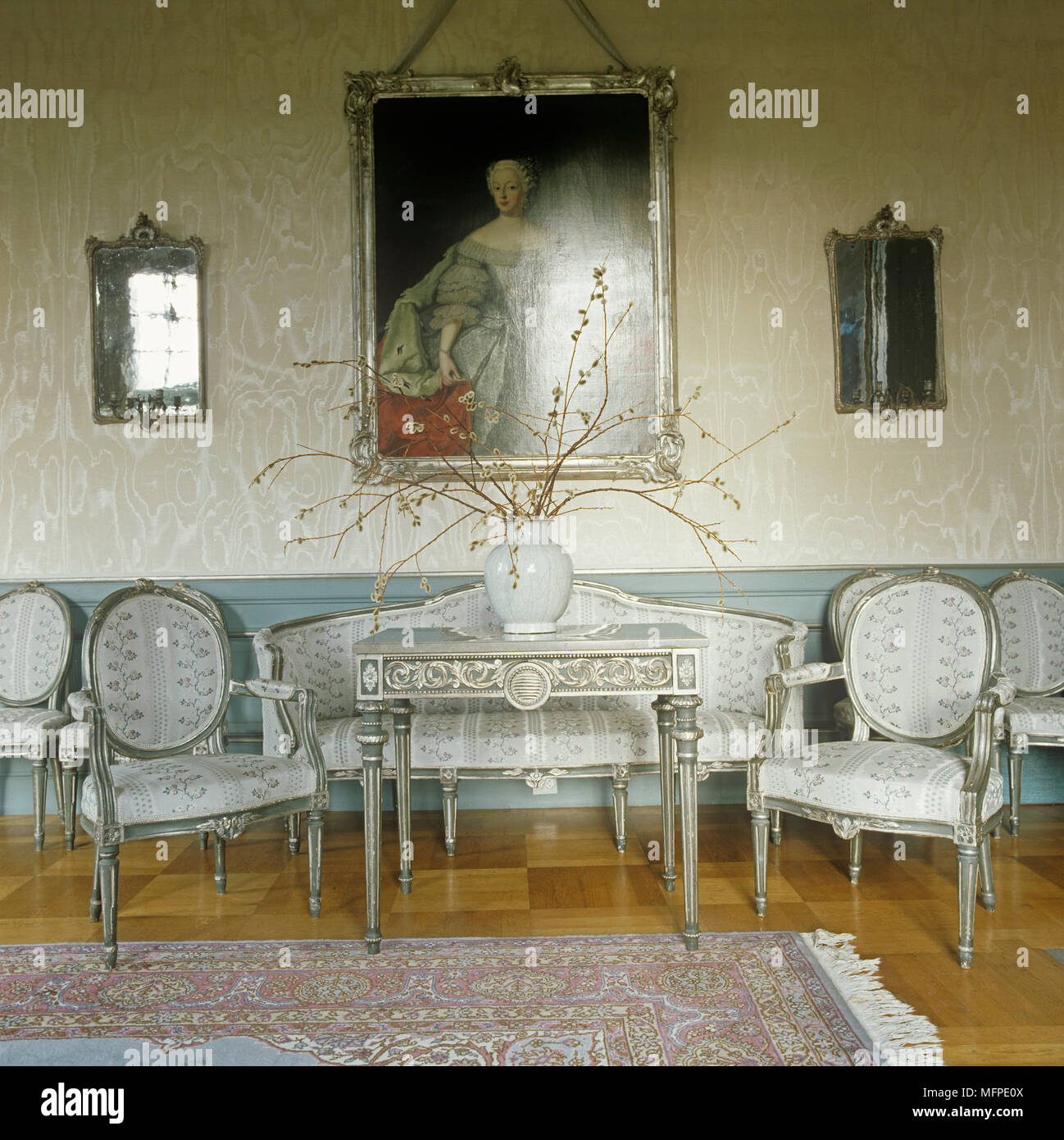 Period style upholstered furniture and console table in grand room ...