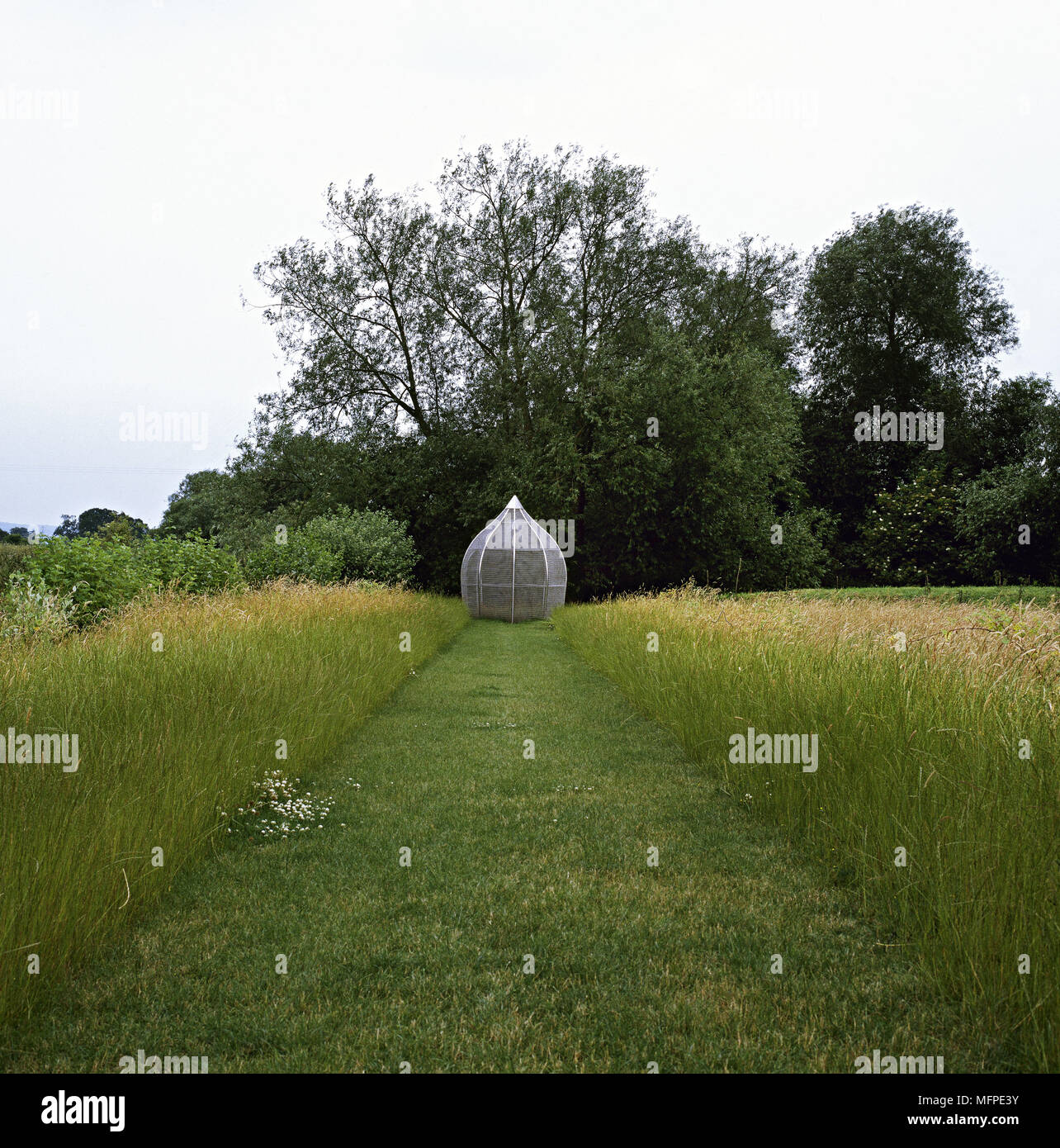 Wire mesh conical shaped structure in garden Stock Photo - Alamy