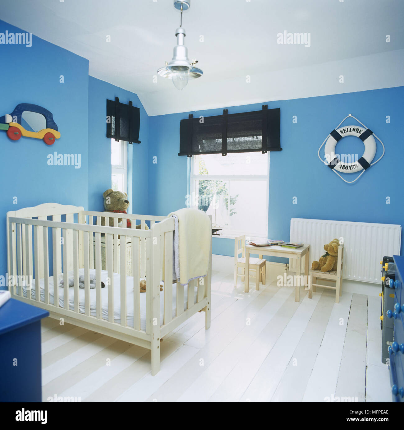 An overview of traditional baby? blue bedroom cot Stock Photo - Alamy