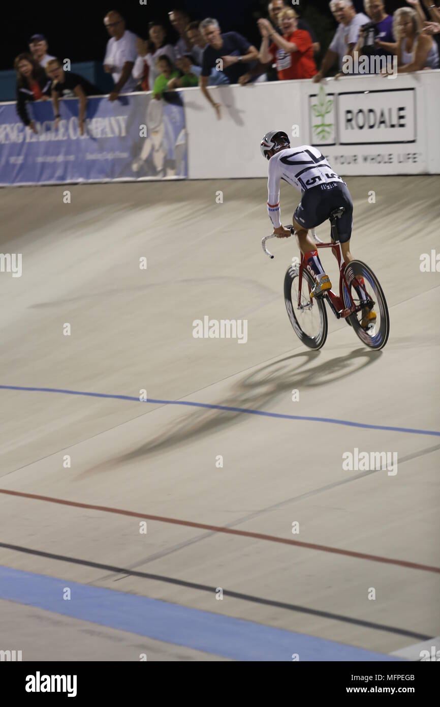 The exhausted bicycle race winner rides past the cheering crowd, T-Town ...