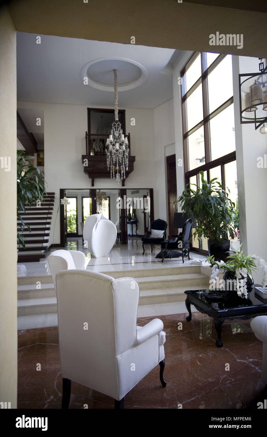 Upholstered seating in modern open plan room Stock Photo - Alamy