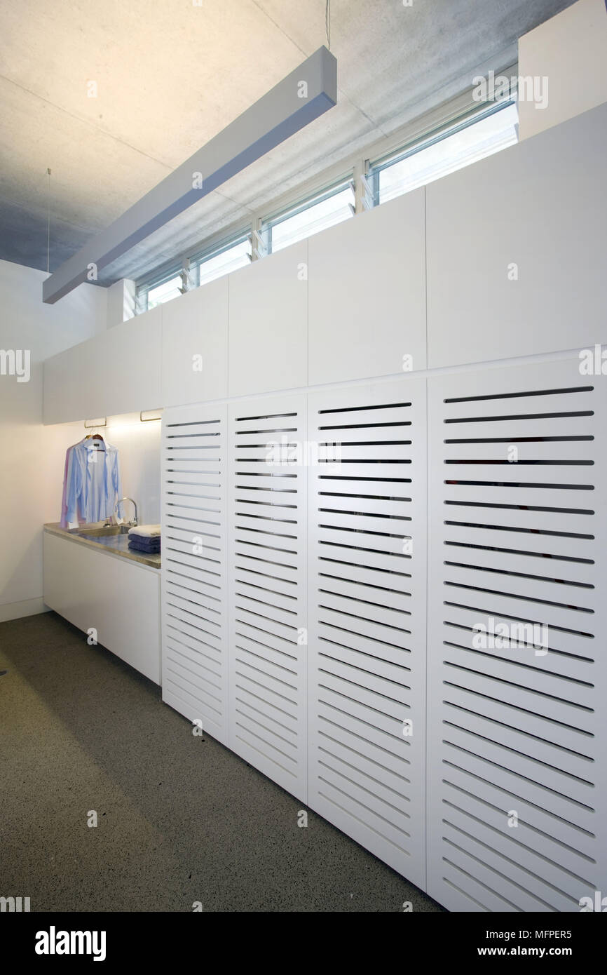 Built in storage units with doors Stock Photo - Alamy