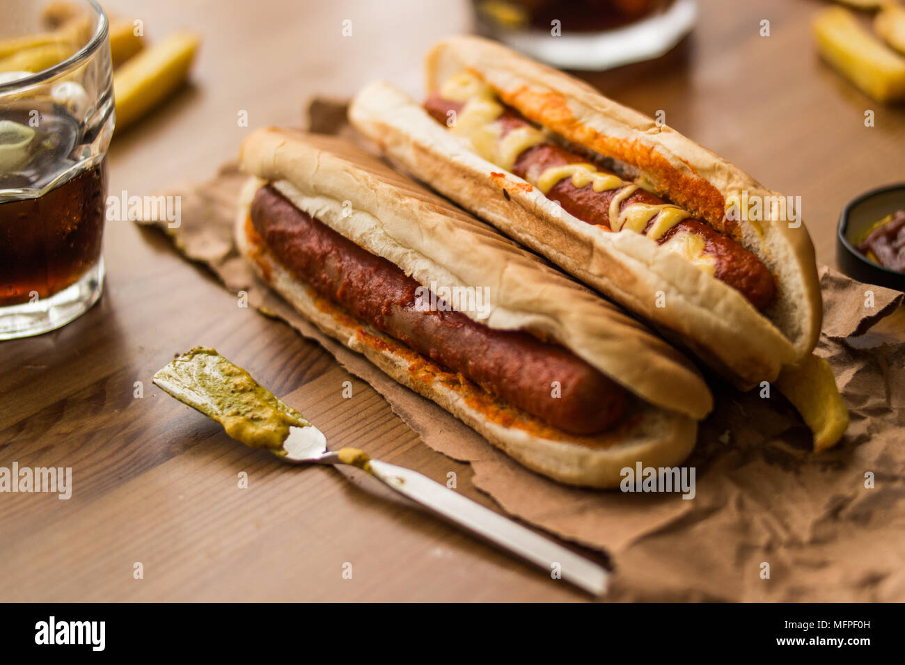 A hot dog (also spelled hotdog) is a cooked sausage, traditionally ...